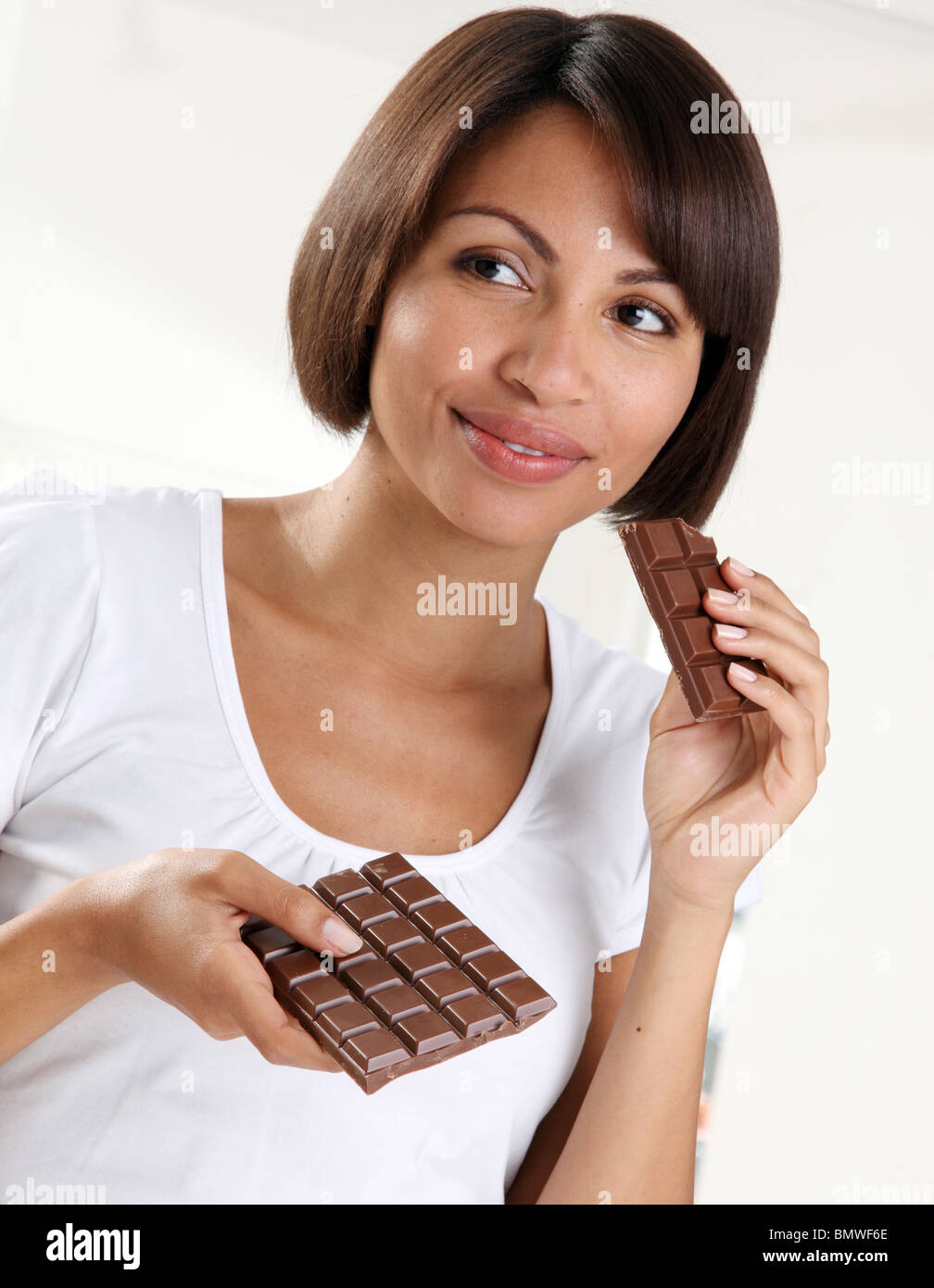 WOMAN EATING CHOCOLATE Stock Photo - Alamy