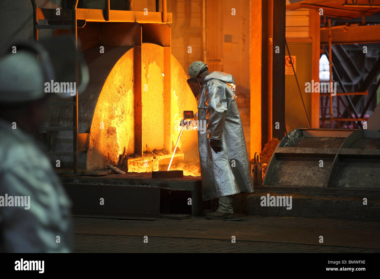 Steelworker furnace gloves hi-res stock photography and images - Alamy