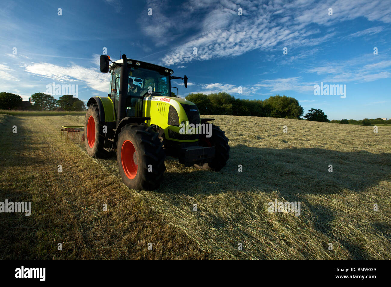 Claas Ares 697ATZ rowing up a hay crop Stock Photo - Alamy