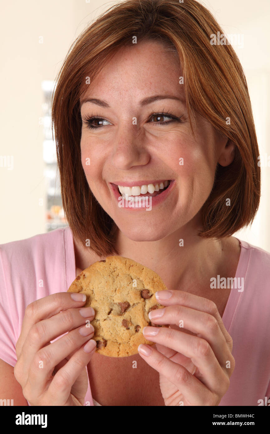 Woman eat cookie chocolate hi-res stock photography and images - Alamy