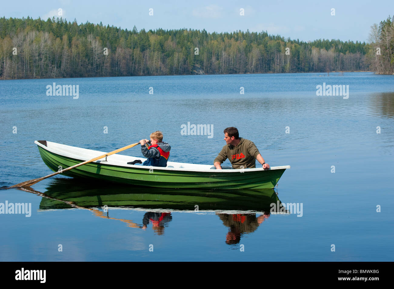 Boy rowing boat hi-res stock photography and images - Alamy