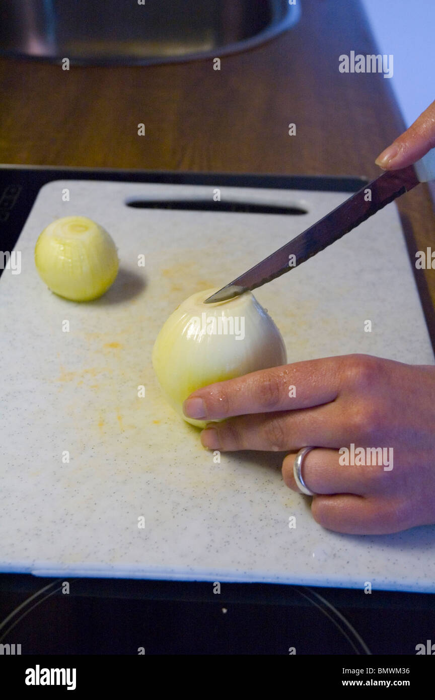 Married woman dicing an onion Stock Photo - Alamy