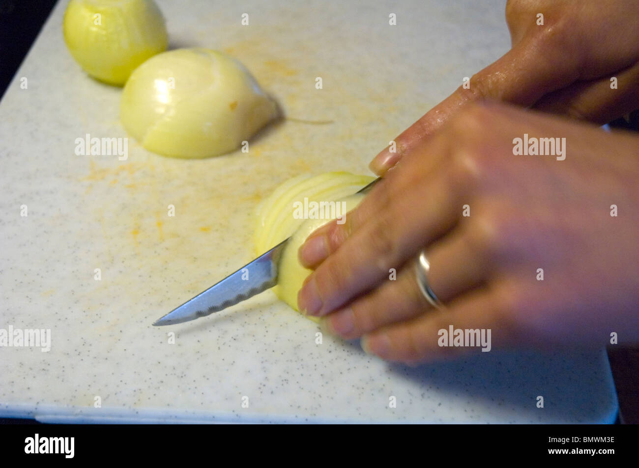 Married woman dicing an onion Stock Photo - Alamy