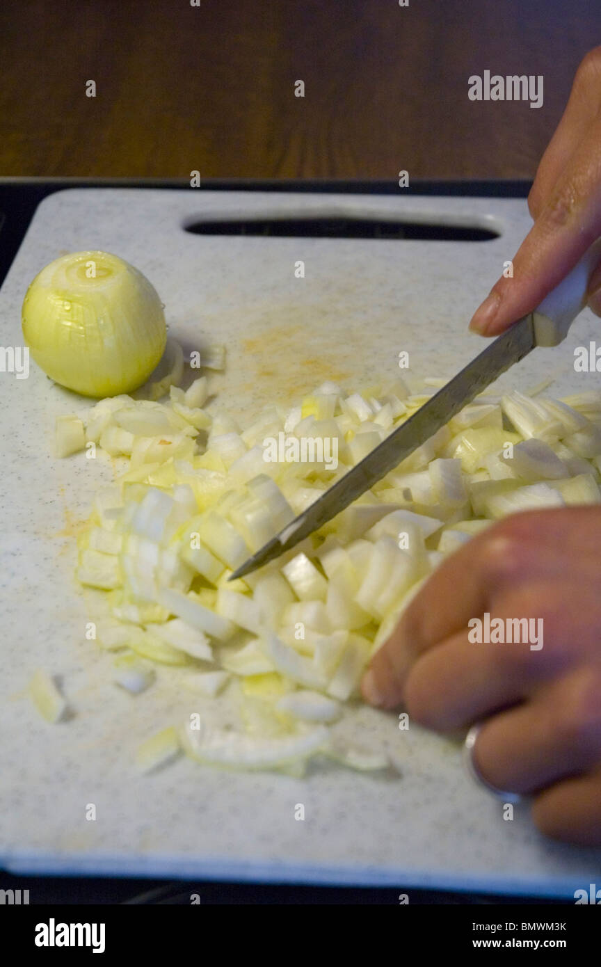 Married woman dicing an onion Stock Photo - Alamy