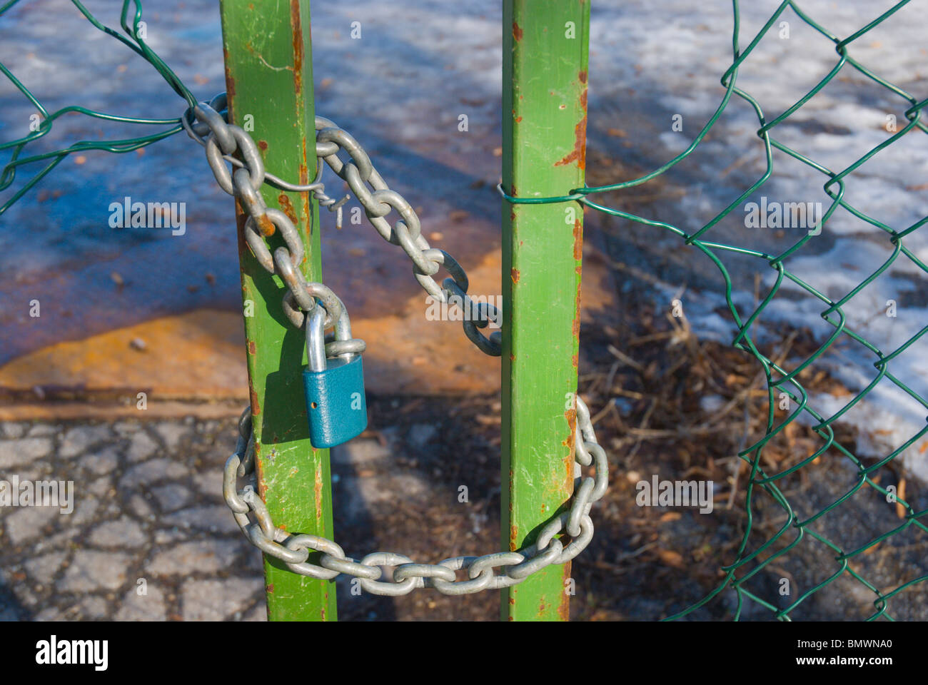 Gate locked with a padlock Stock Photo - Alamy