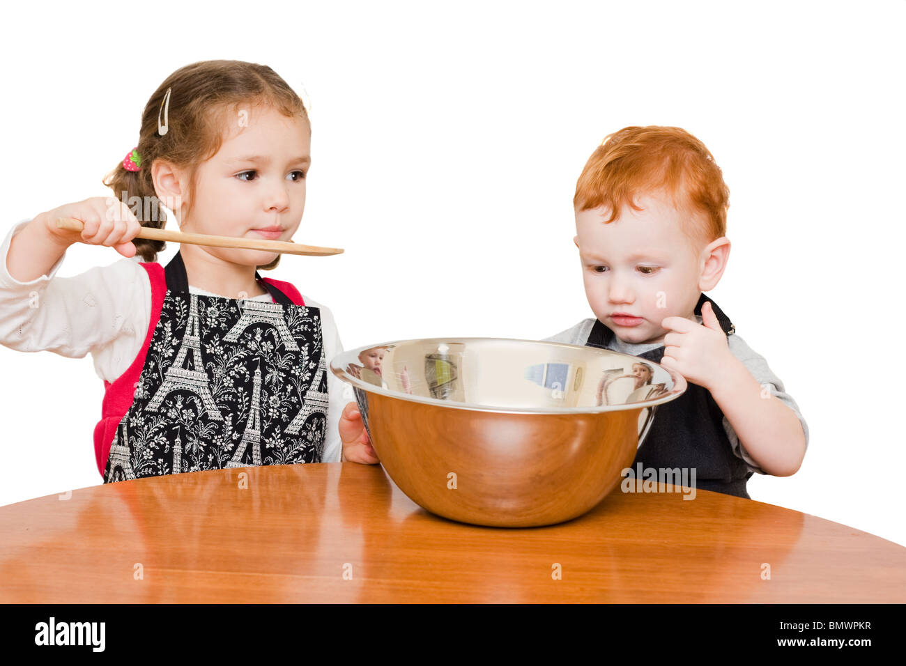 Kids making cake in large mixing bowl. Isolated on white Stock Photo ...