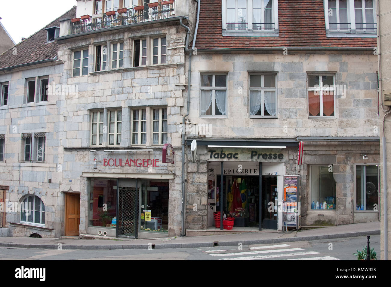 narrow windows door street hill shop buildings Stock Photo - Alamy