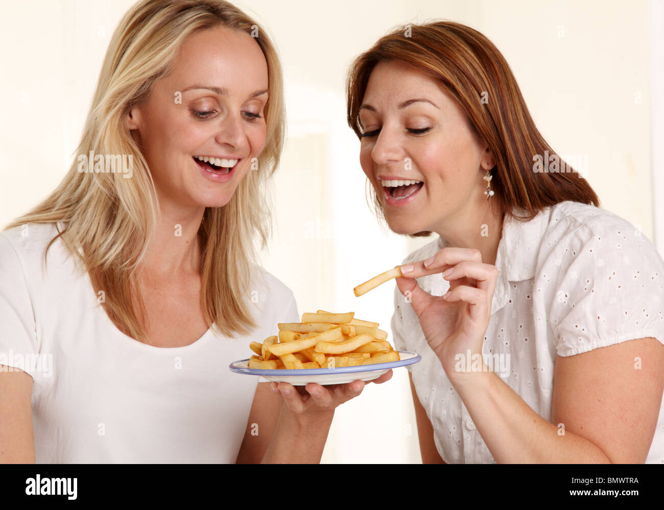 Woman Eating French Fries
