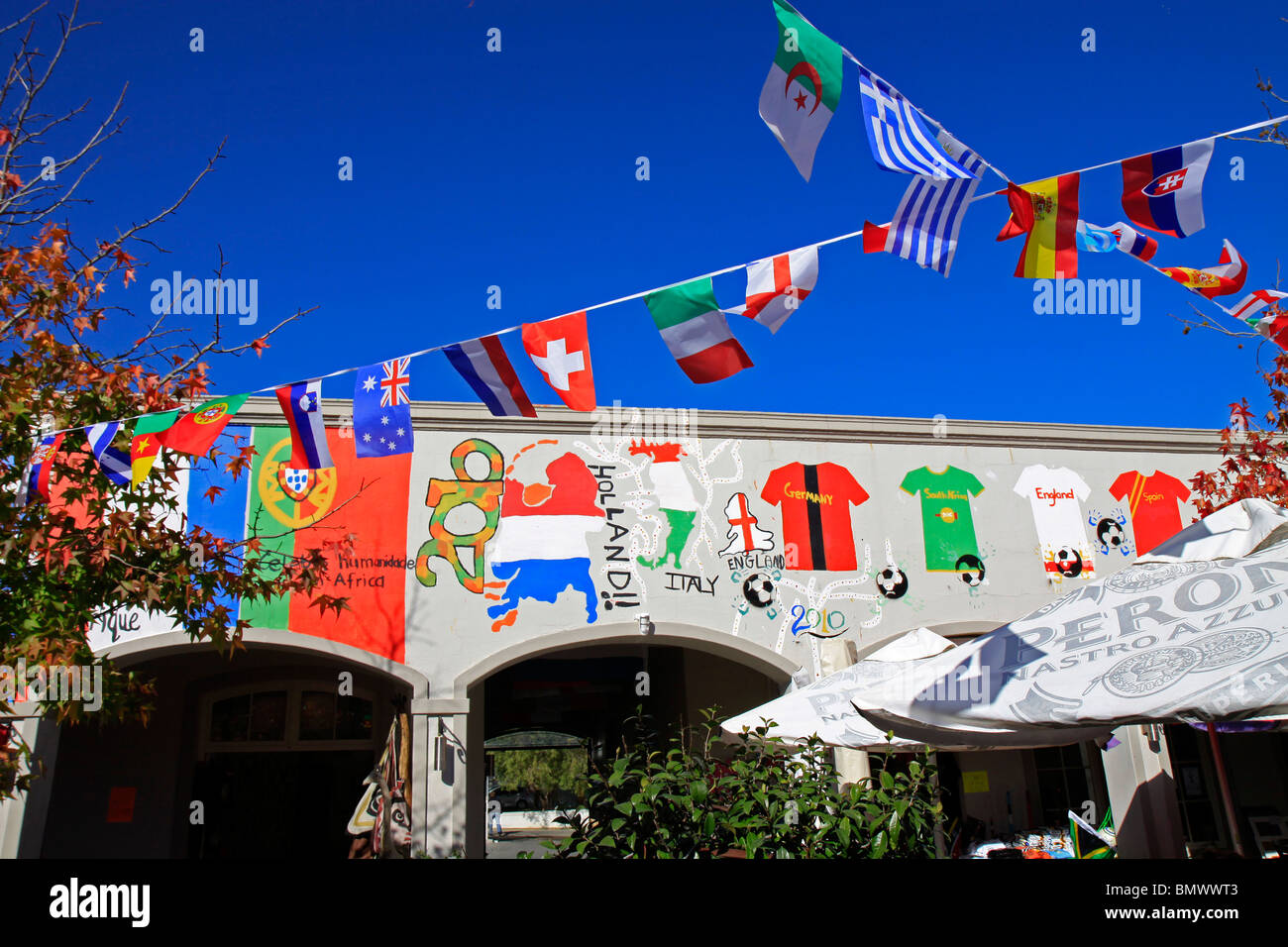 Colourful murals and flags celebrating 2010 FIFA World cup on wall in ...