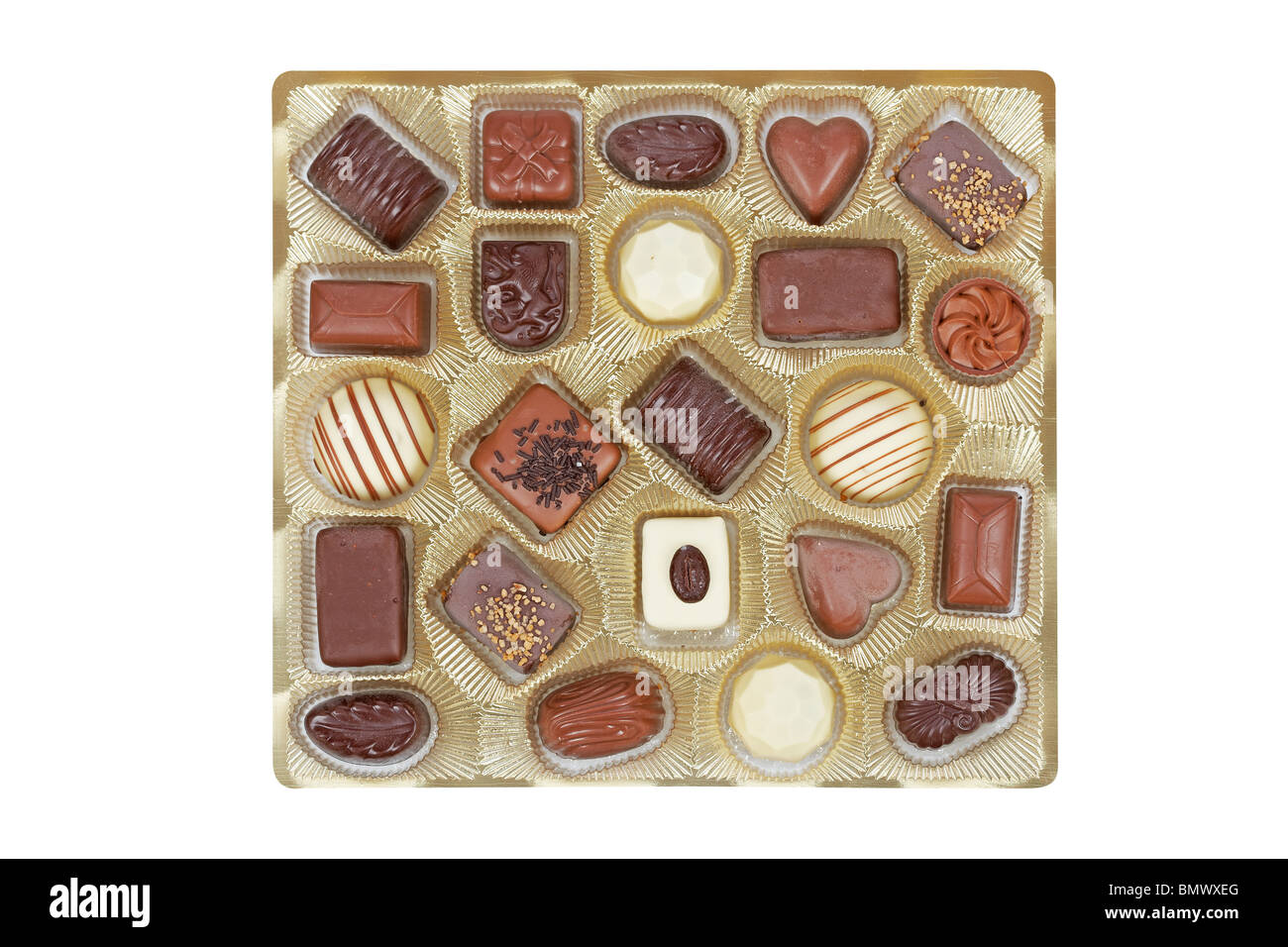 Sweet tasty chocolate candies in a gold box isolated on white ...