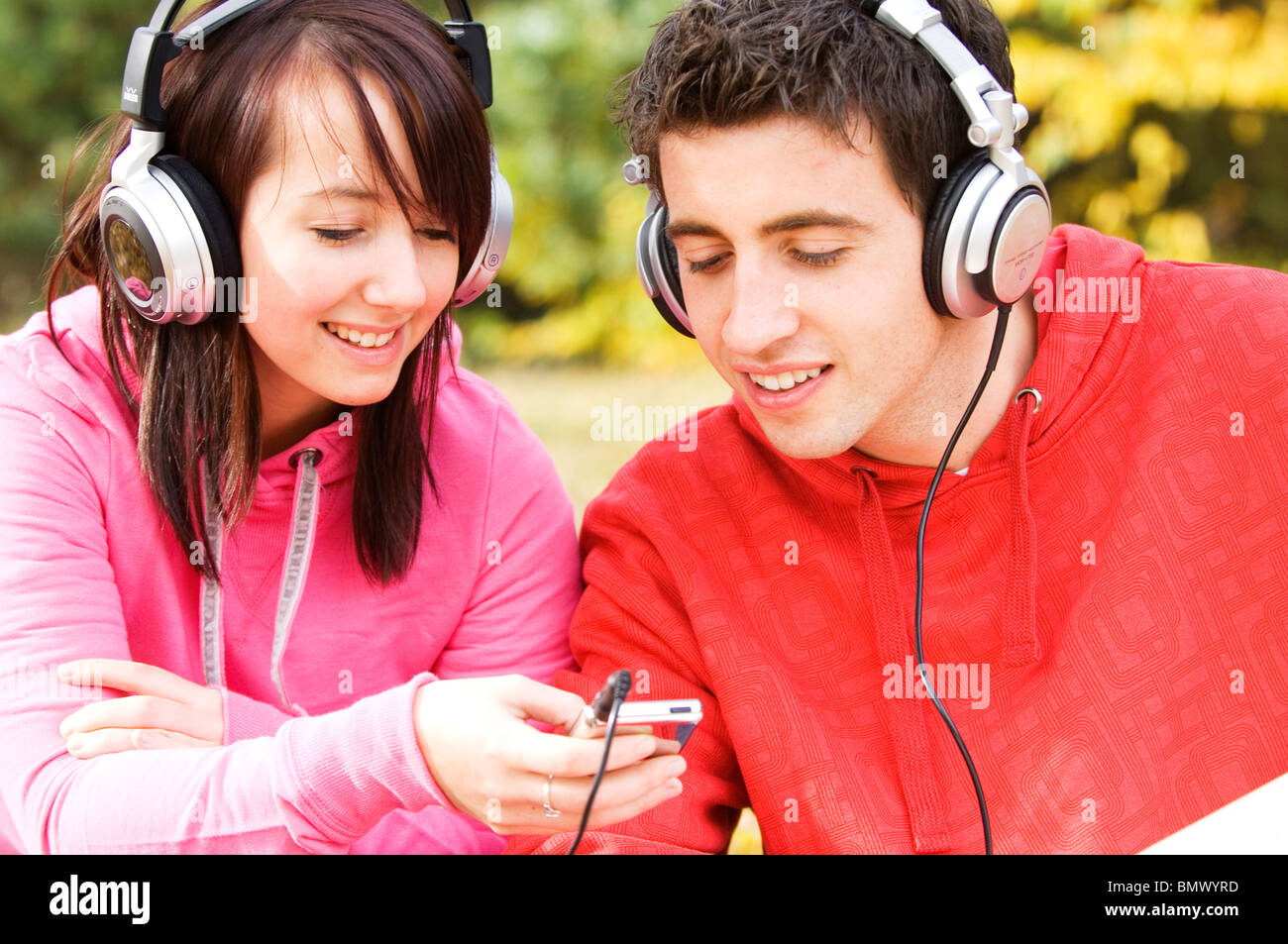 young couple sharing music Stock Photo - Alamy