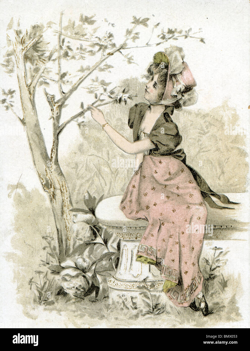 Lady Smelling Flowers in the Garden Stock Photo - Alamy