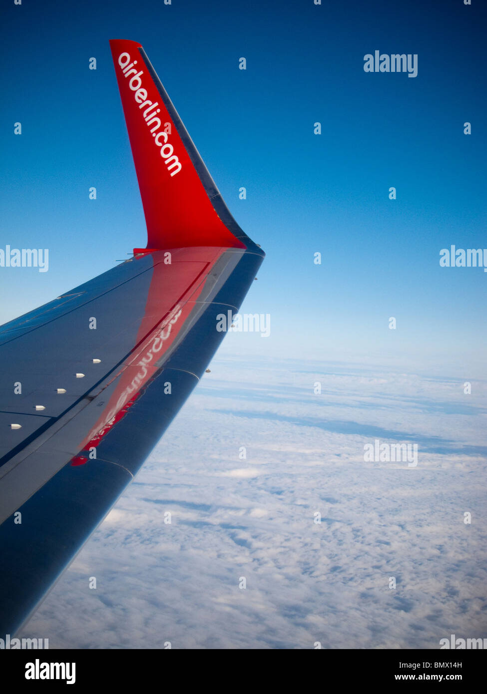 Aeroplane / Airplane wing during take-off / flight. Red tip to wing ...