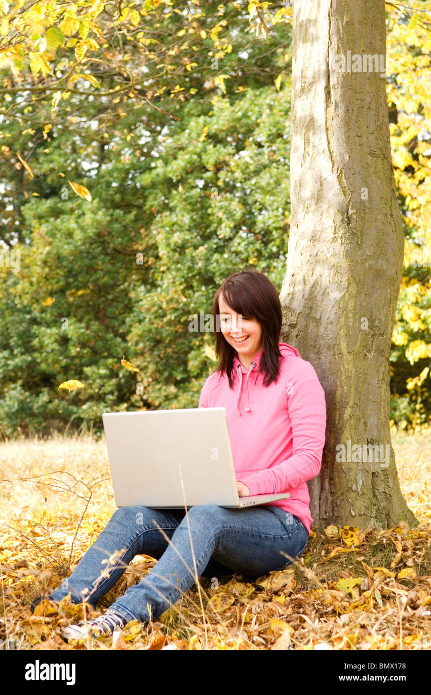 youth using laptop outdoors Stock Photo - Alamy