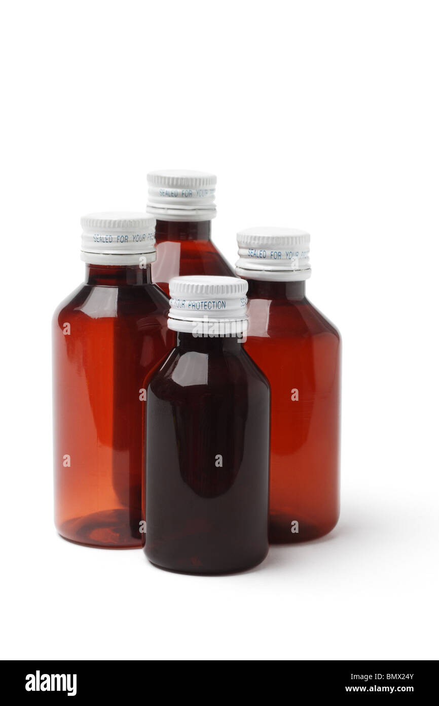 Four empty medicine bottles on white background Stock Photo - Alamy