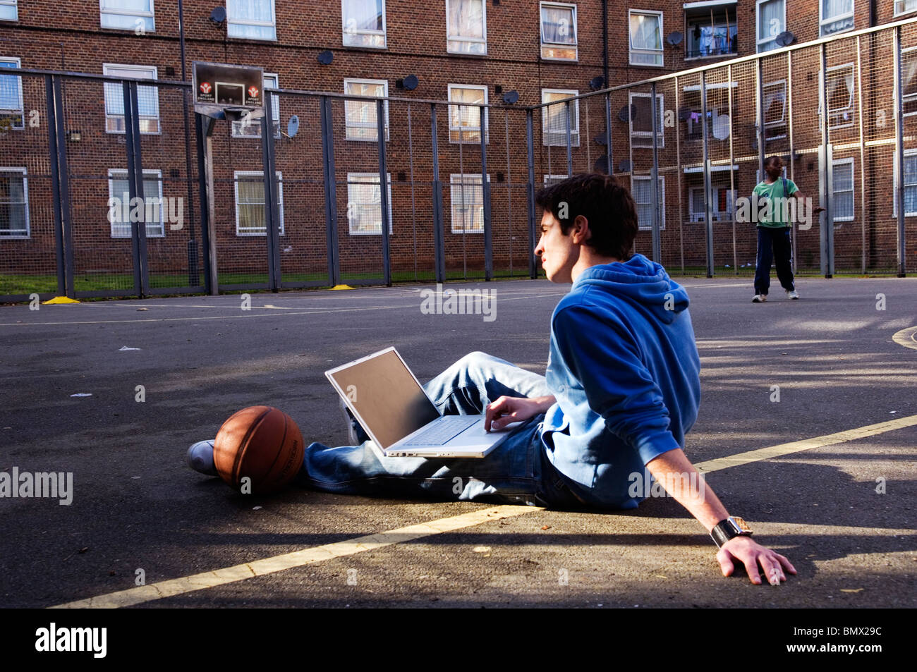 youth using laptop outdoors Stock Photo - Alamy