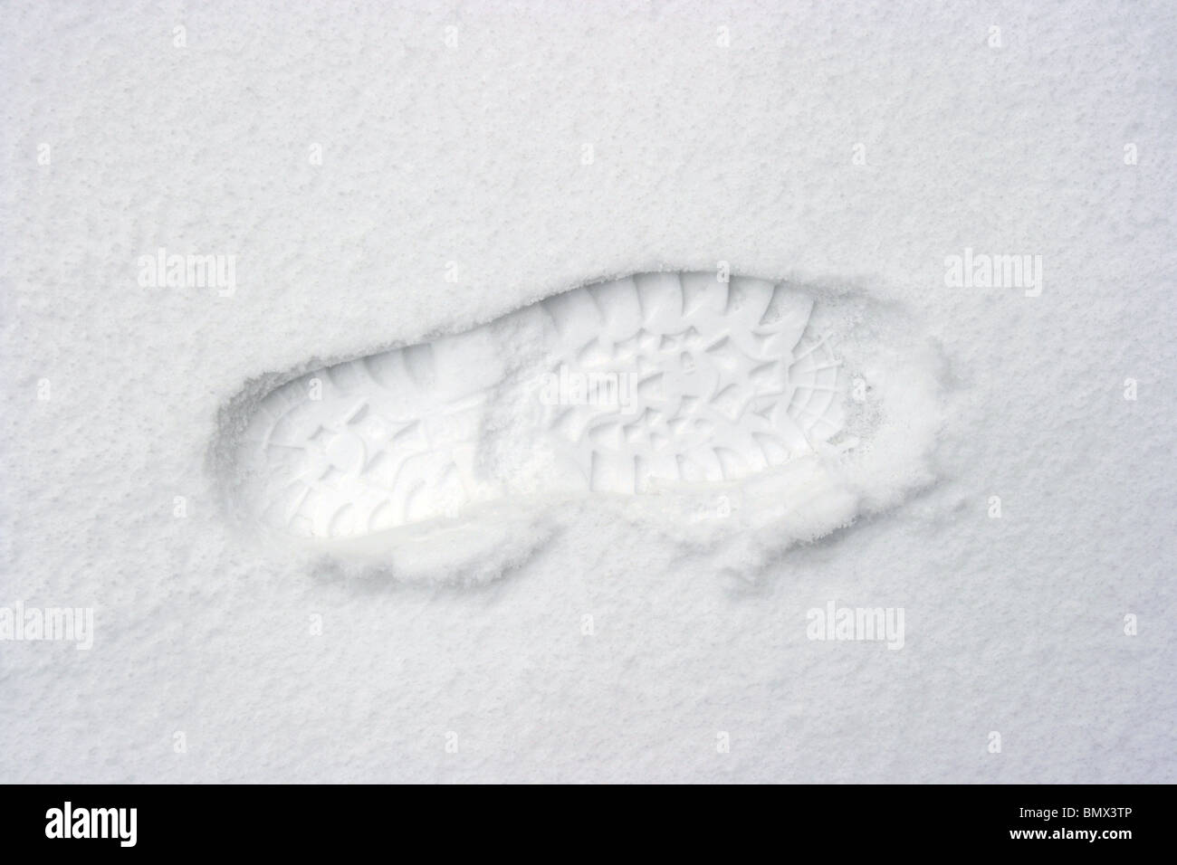 Footprint of boots in fresh white snow Stock Photo - Alamy