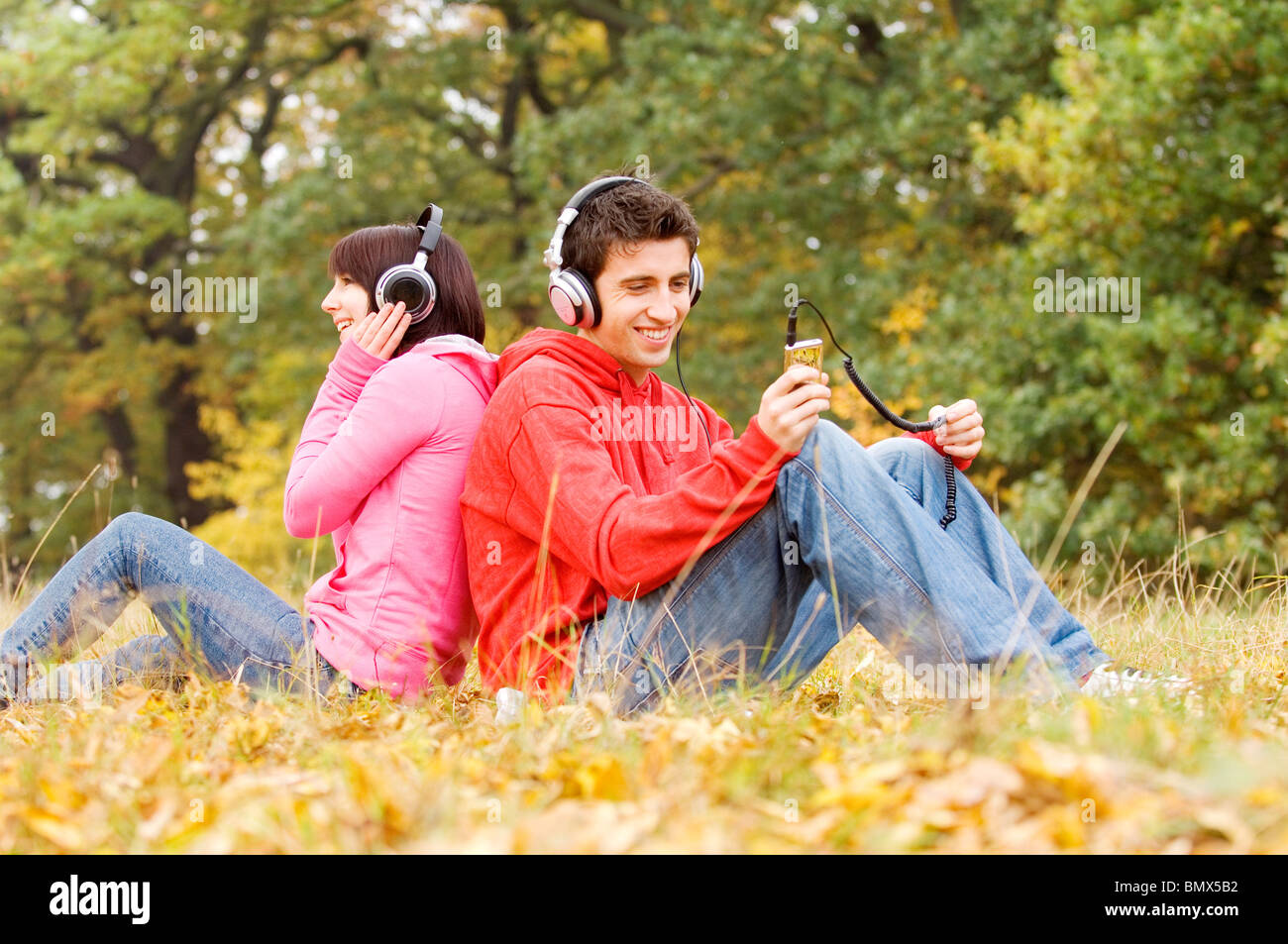 young couple sharing music Stock Photo - Alamy