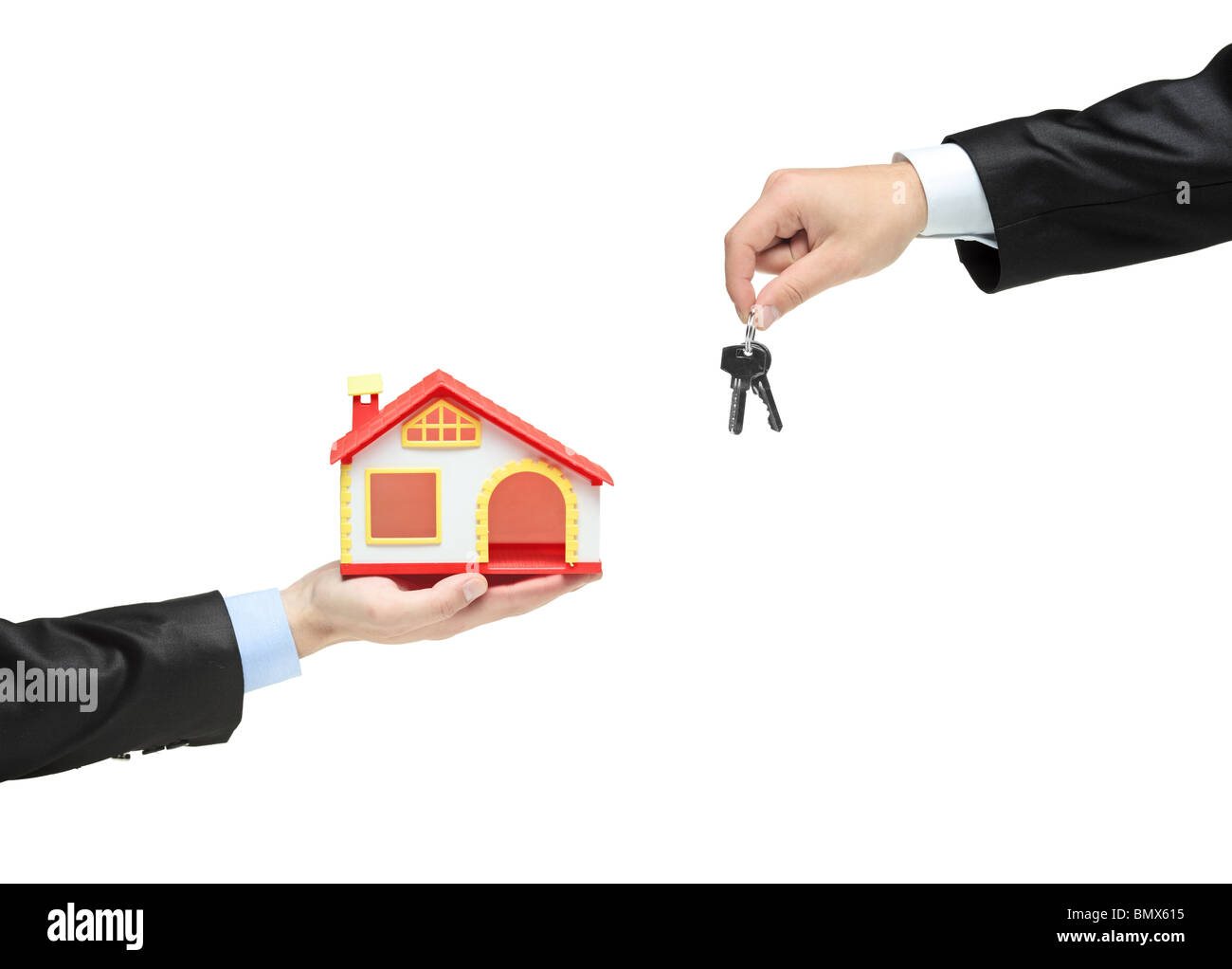 Real estate agent holding keys from your new house Stock Photo - Alamy