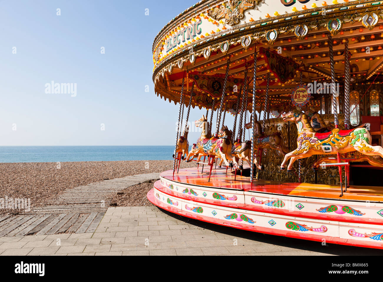 A merry-go-round on the beach at Brighton, East Sussex, England, UK ...