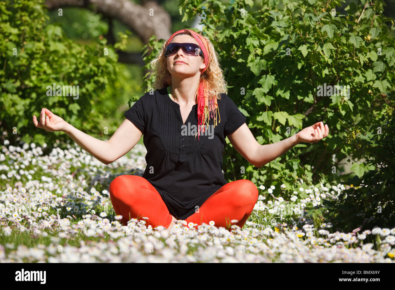 Hippie meditating outdoors hi-res stock photography and images - Alamy