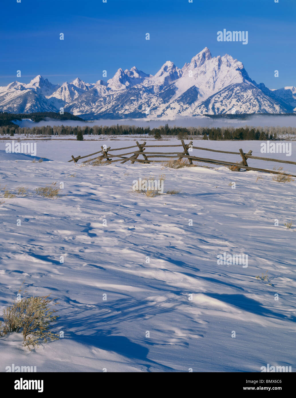 Grand Teton National Park, WY Teton Range with fence line crossing the ...