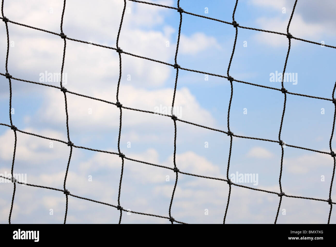 Football goal netting against a cloudy blue sky Stock Photo - Alamy