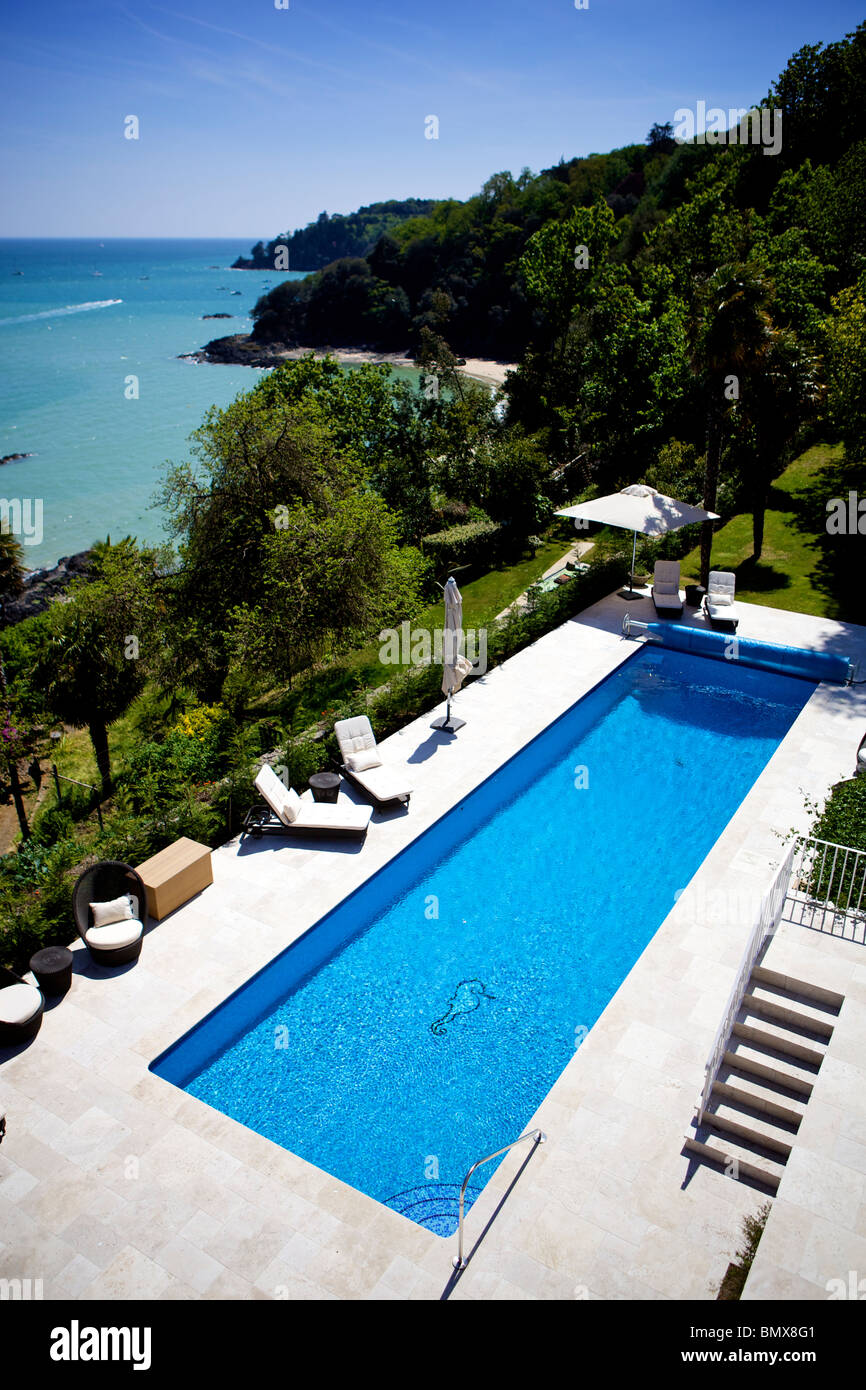 A swimming pool at a hotel during summer Stock Photo - Alamy