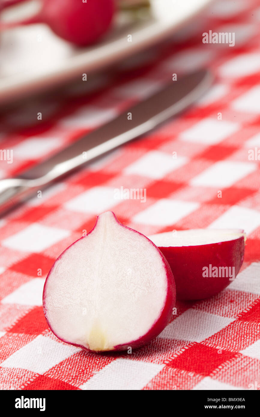 fresh radish on checkered tablecloth Stock Photo - Alamy