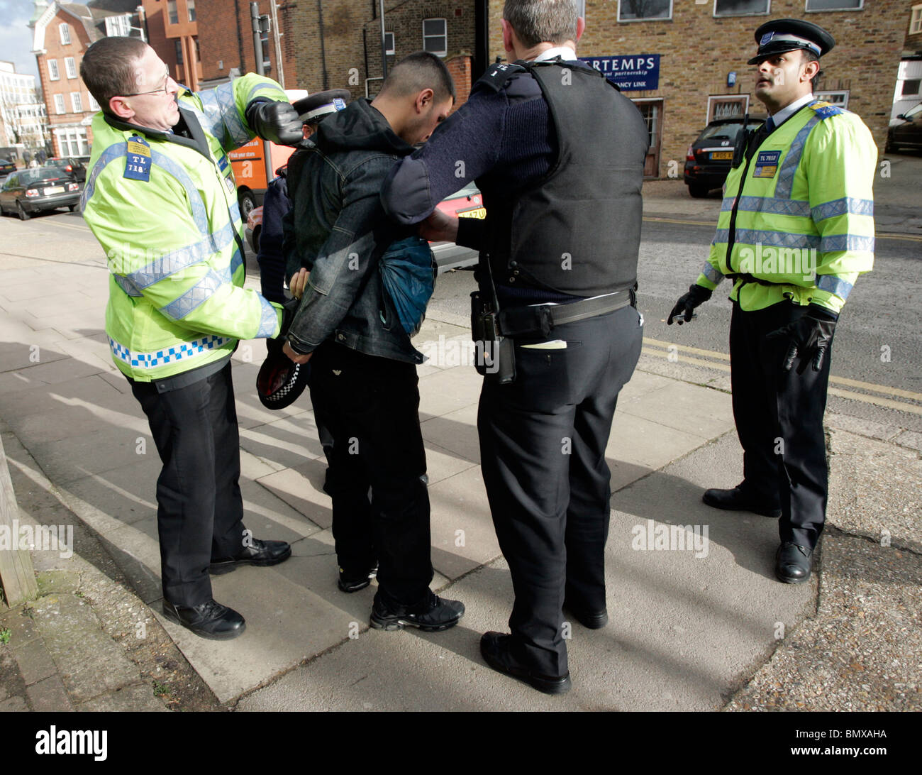 a man is arrested in a north west london street Stock Photo - Alamy
