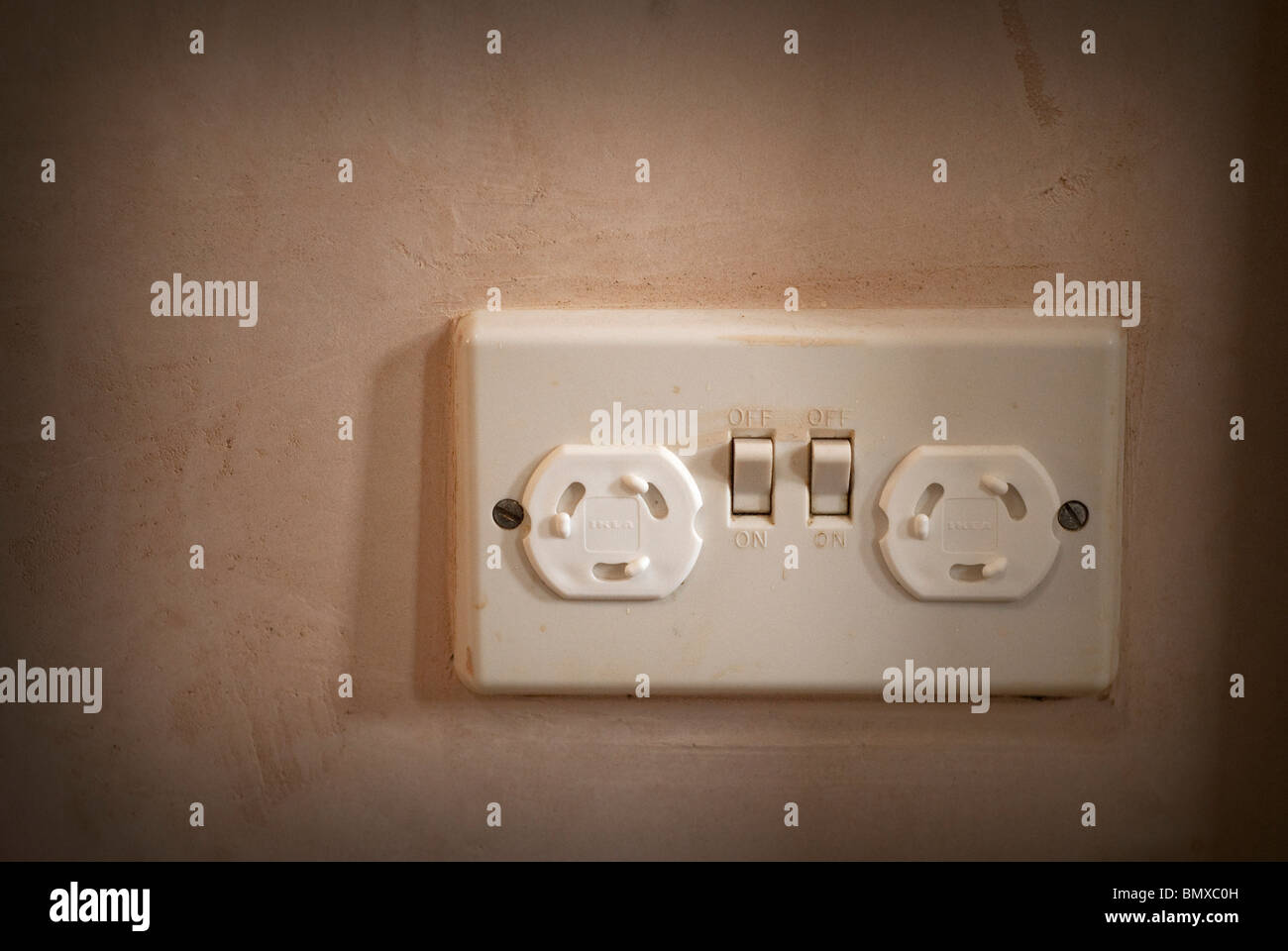 Electric sockets with child safety cover. Dated 1970's moldings on bare ...