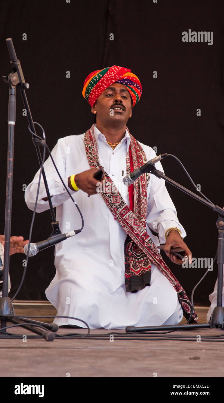 Rajasthani percussion player playing khartal / karthal / khadtal during ...