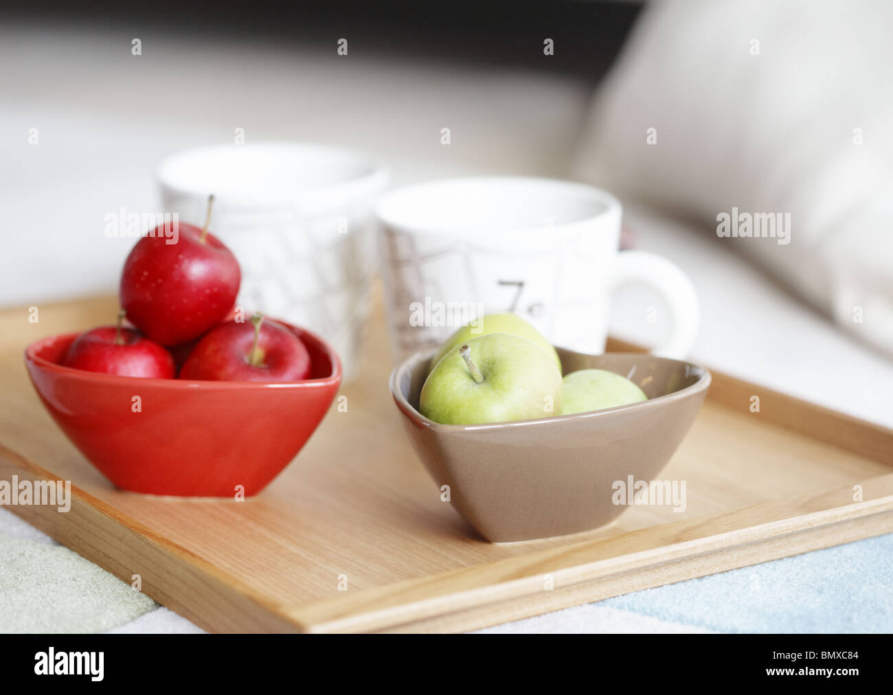 Apple and mug Stock Photo - Alamy