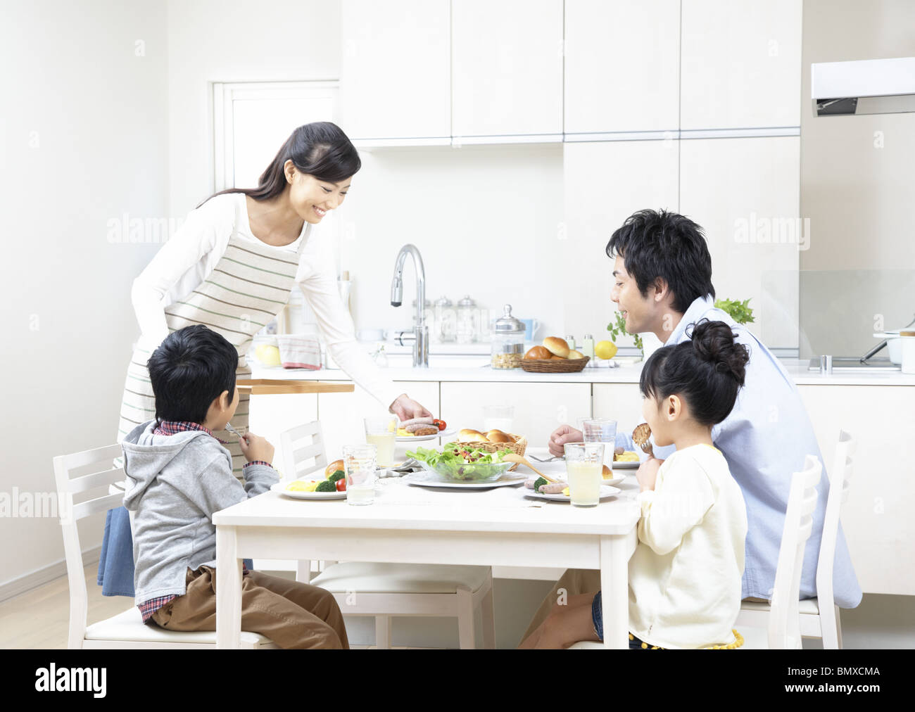 Parents sit eating hi-res stock photography and images - Alamy