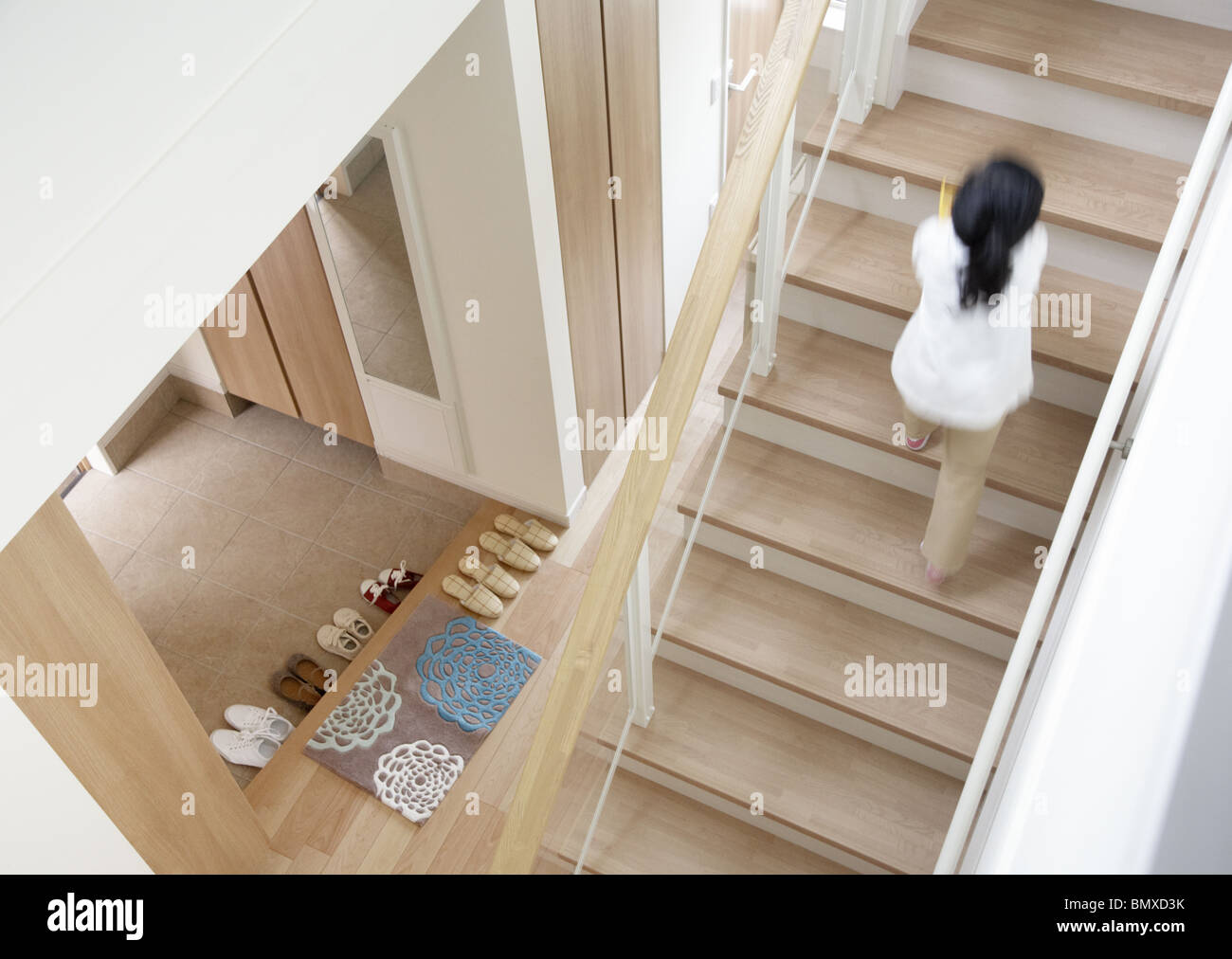 Girl climbing stairs Stock Photo - Alamy