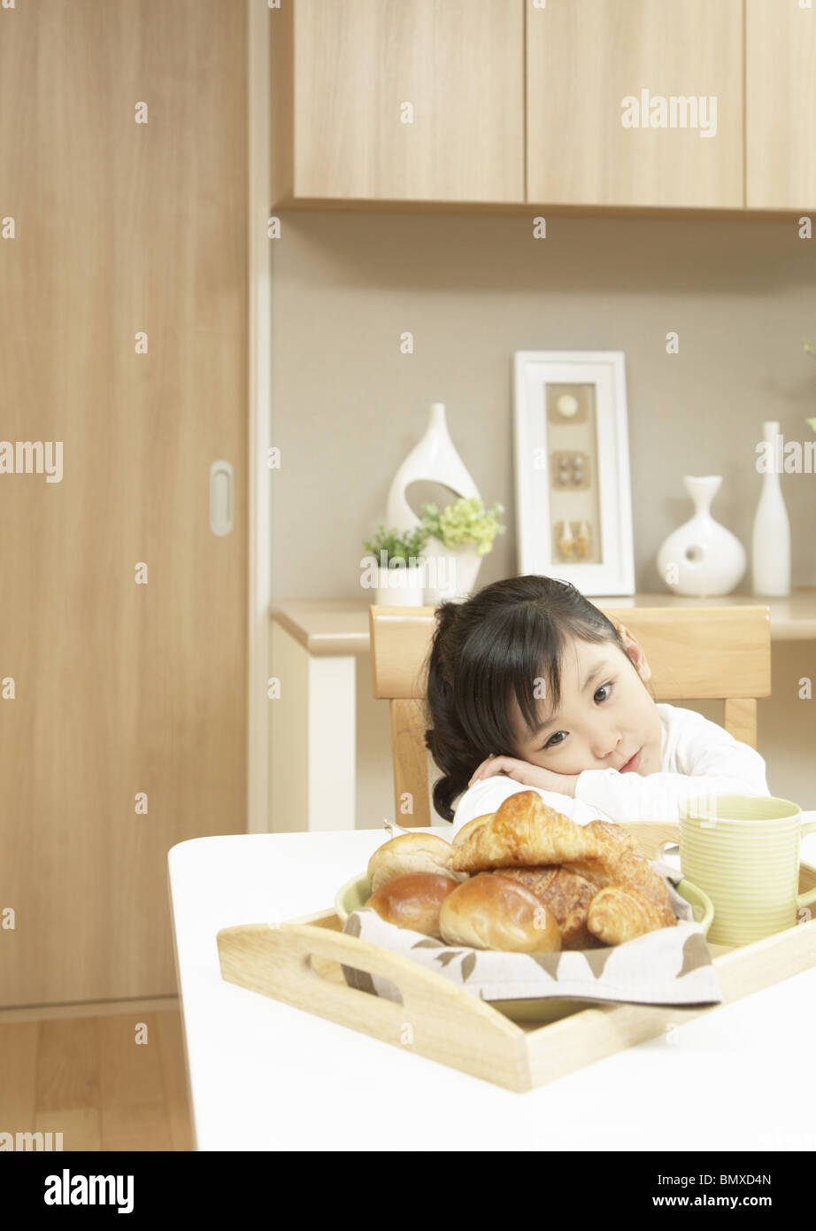 Girl in dining room Stock Photo - Alamy