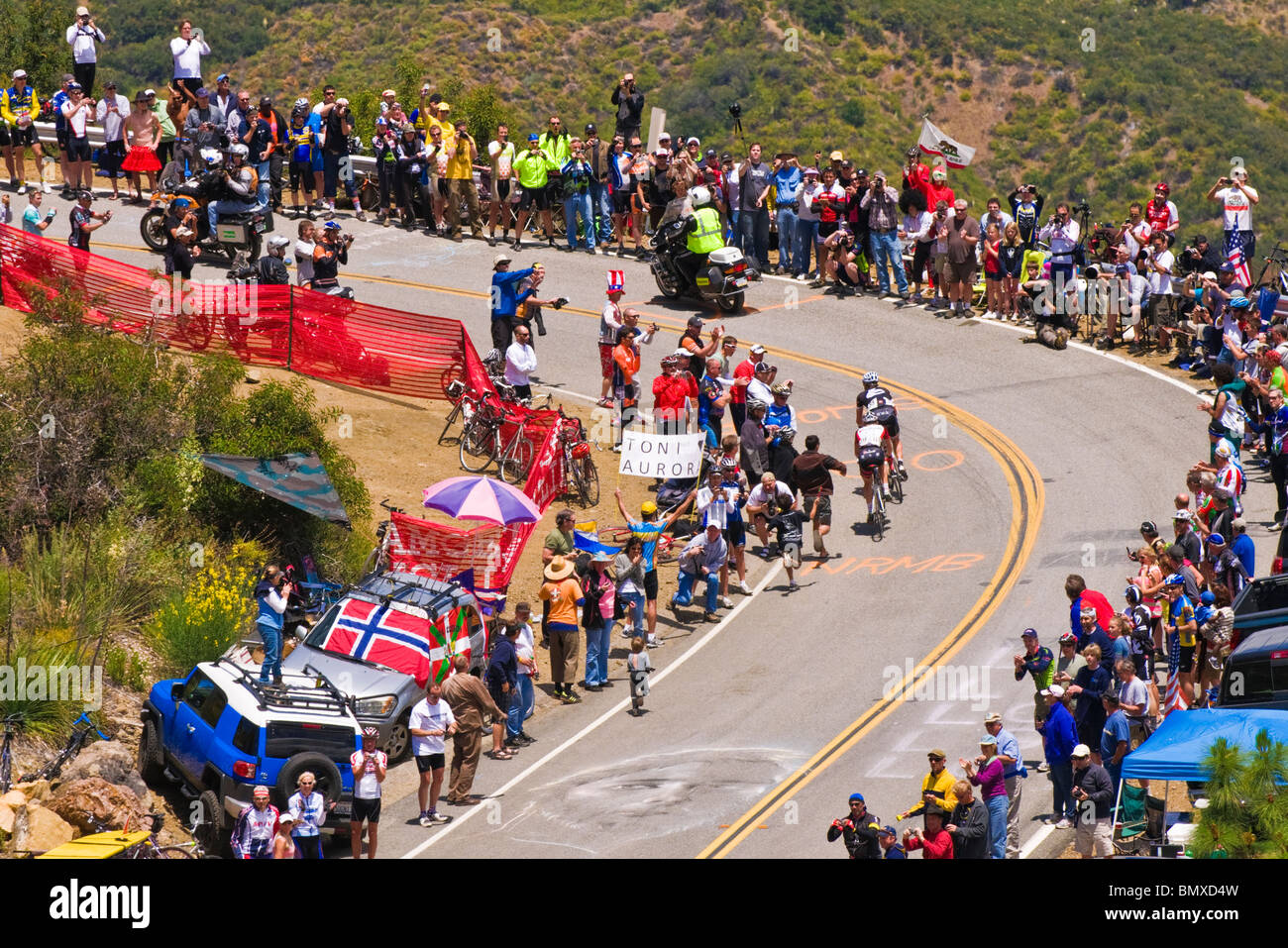 Professional cyclists and spectators at the Amgen Tour of California ...