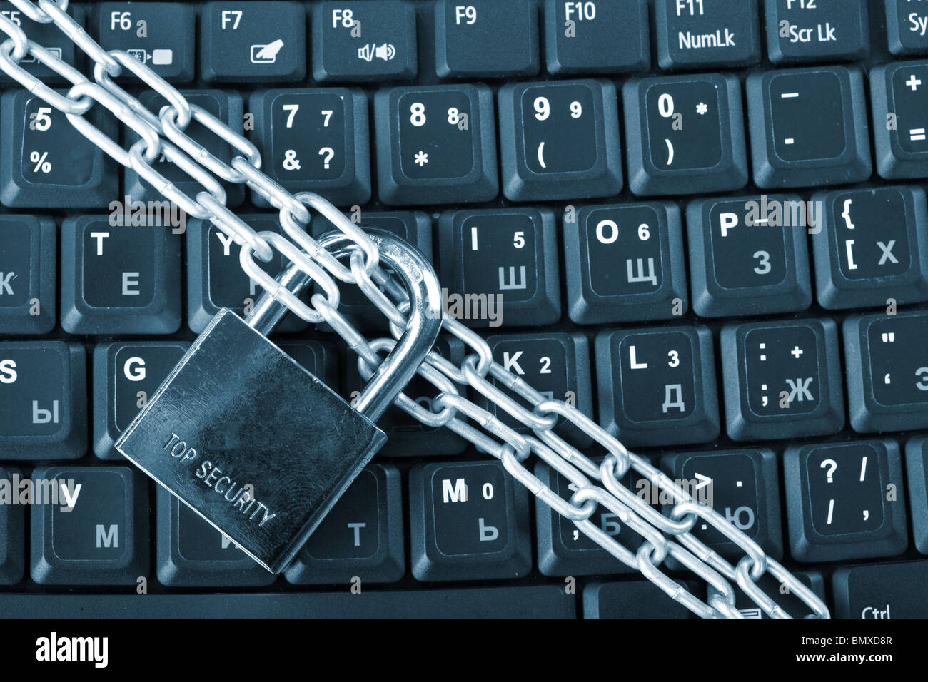 laptop keyboard secured with chain and padlock Stock Photo - Alamy