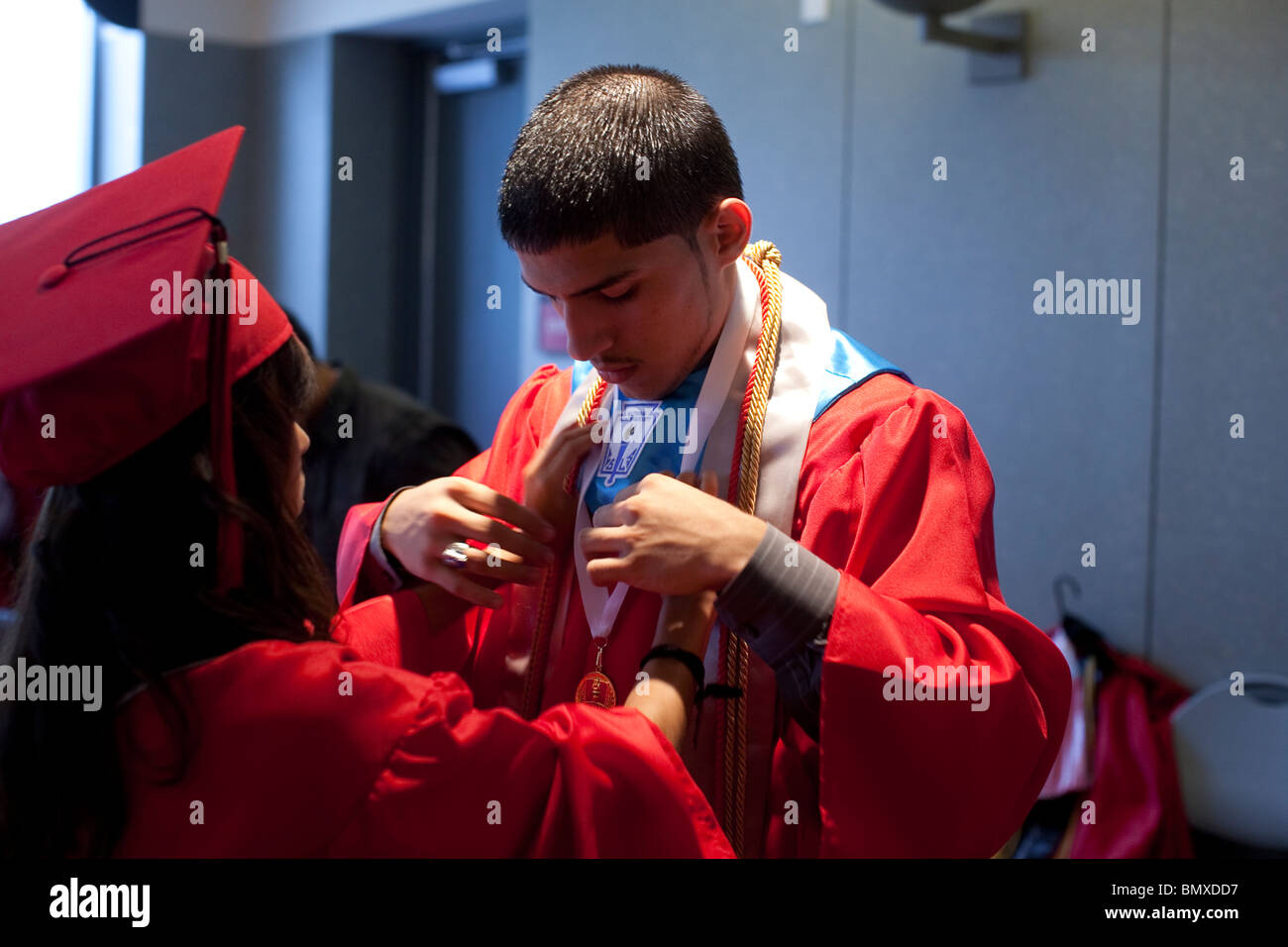 Hispanic boy prepares for his high school graduation ceremony at KIPP ...