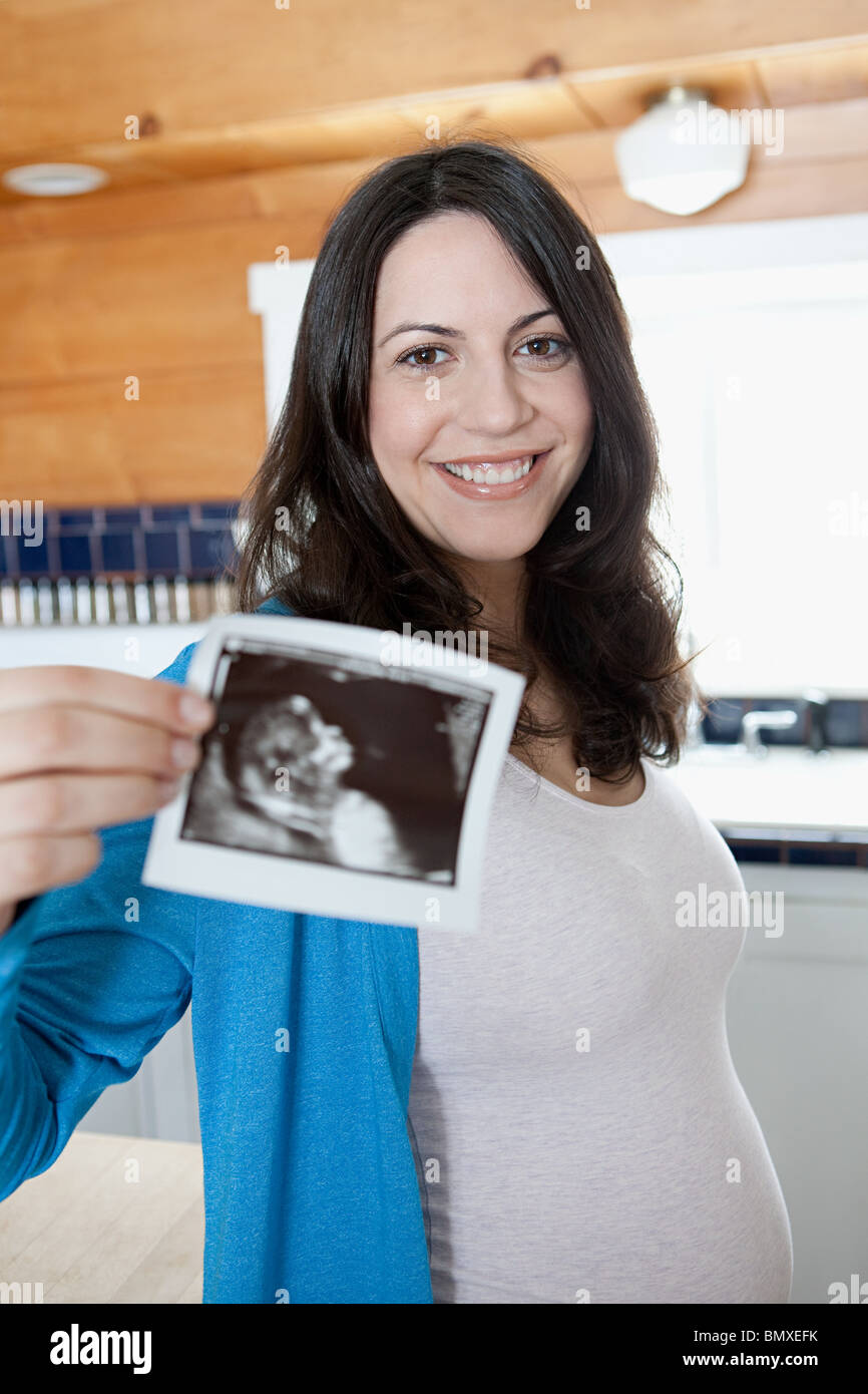 Pregnant woman with ultrasound scan Stock Photo - Alamy
