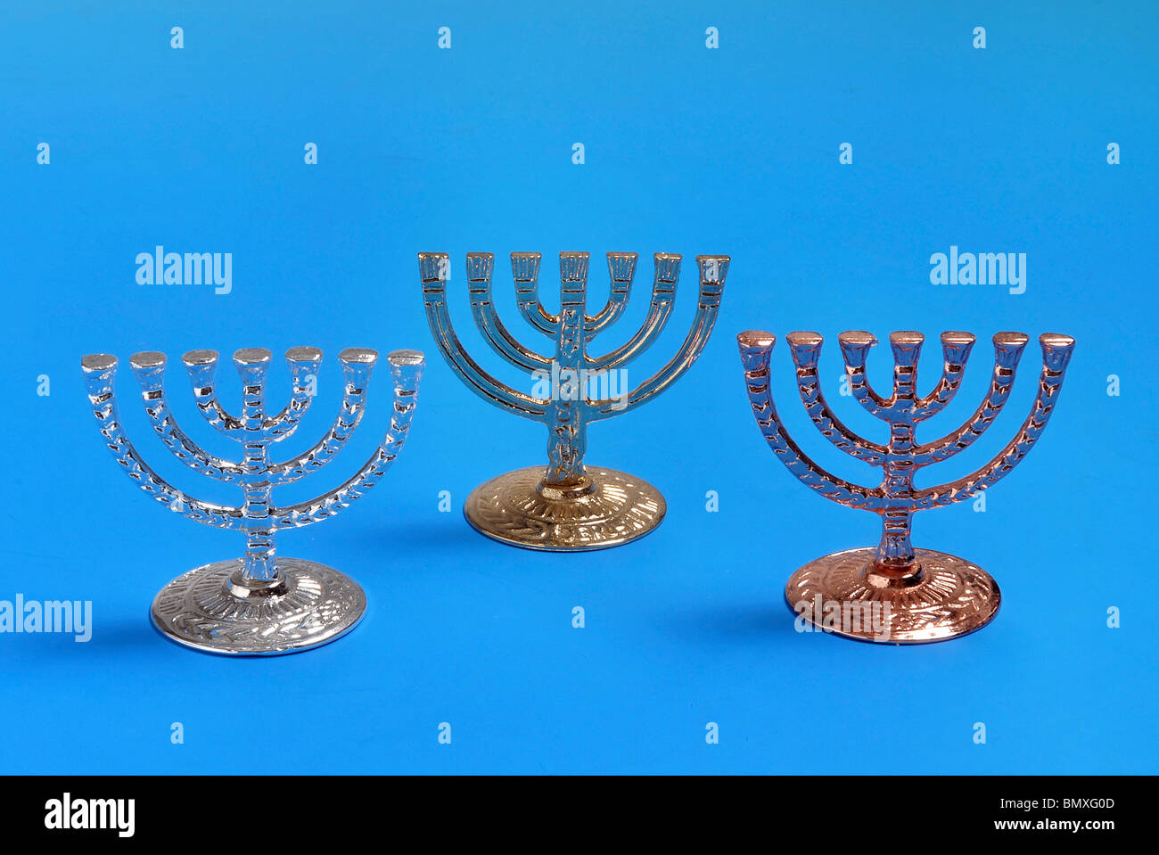 Miniature Menorah on Blue Background Stock Photo - Alamy