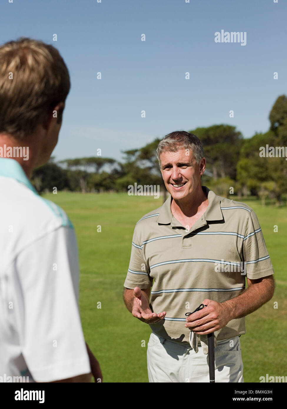 Mature men playing golf hi-res stock photography and images - Alamy