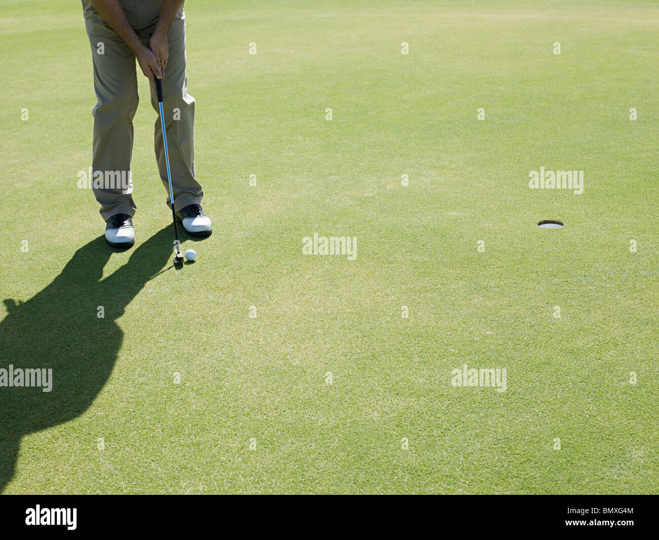 Golf ball over hole hi-res stock photography and images - Alamy