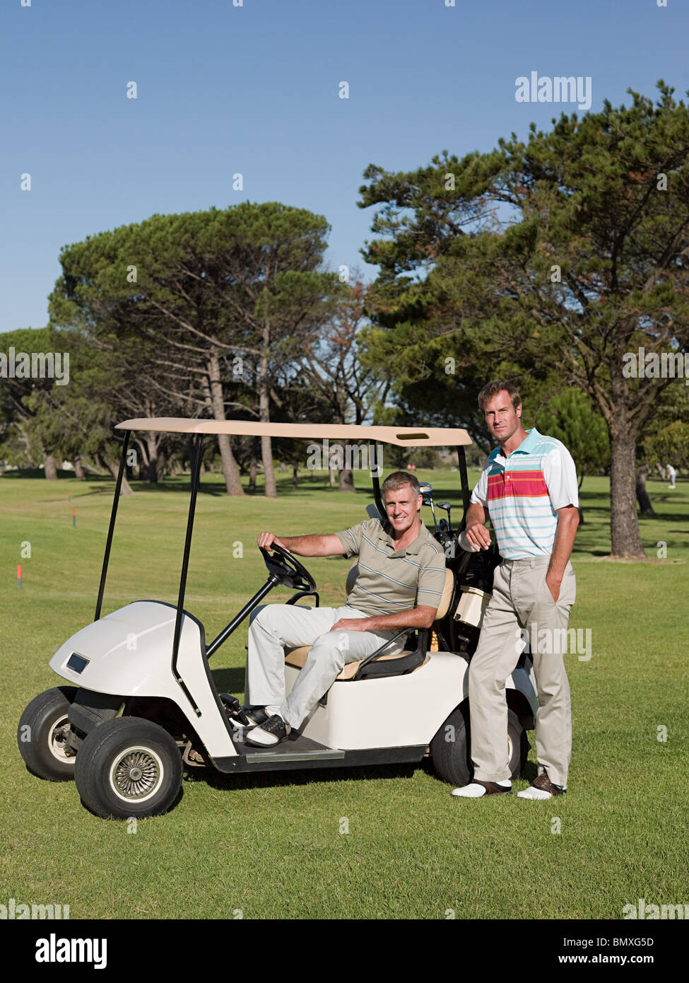 Man sitting in golf cart hi-res stock photography and images - Alamy