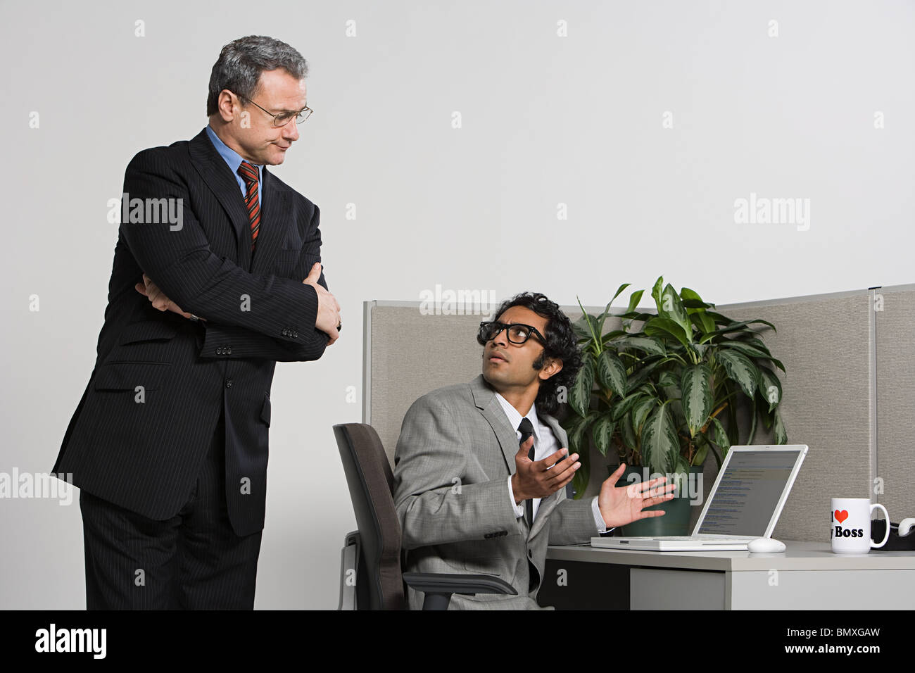 Boss watching over businessman Stock Photo - Alamy