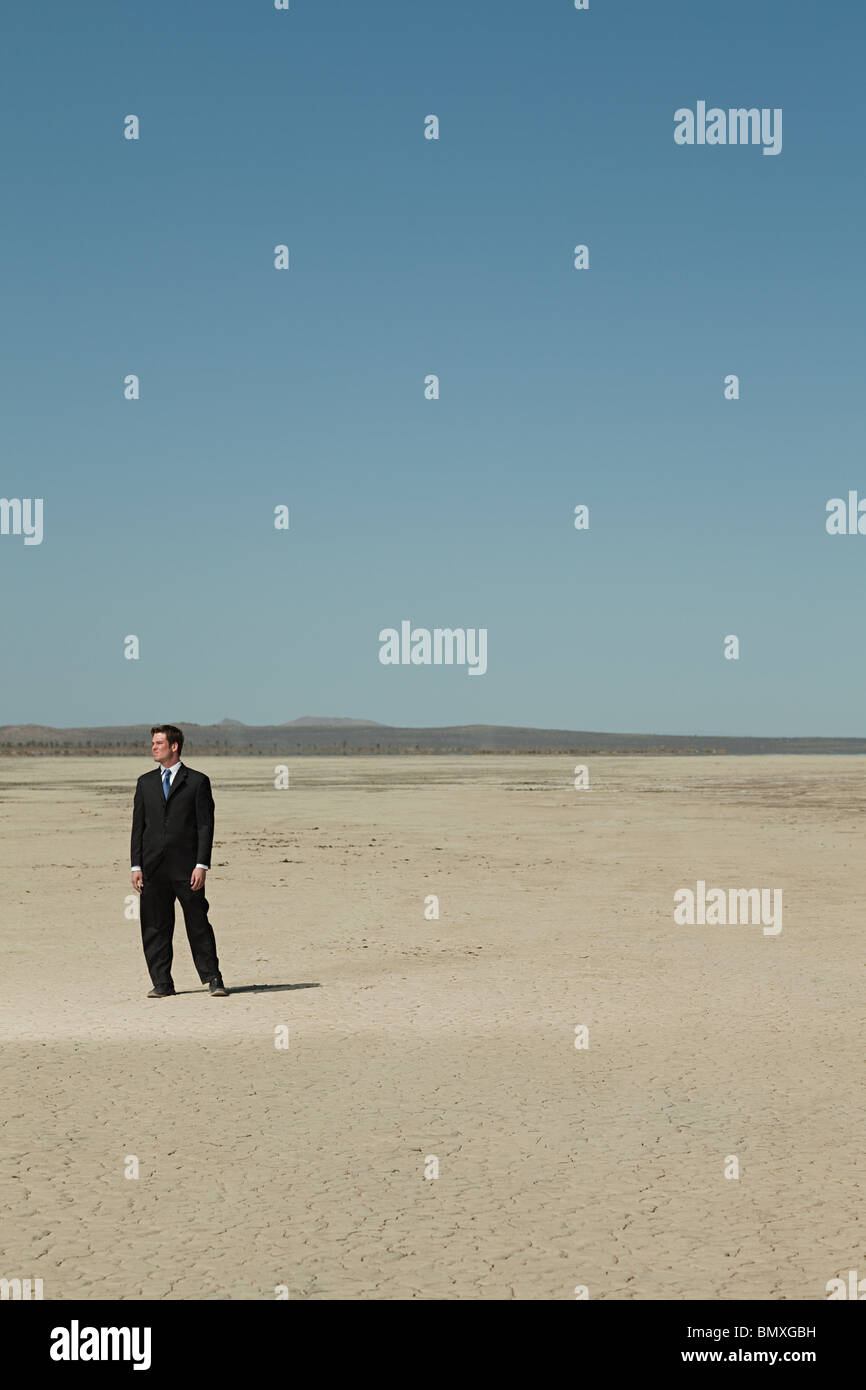 Businessman in suit lost in desert hi-res stock photography and images ...