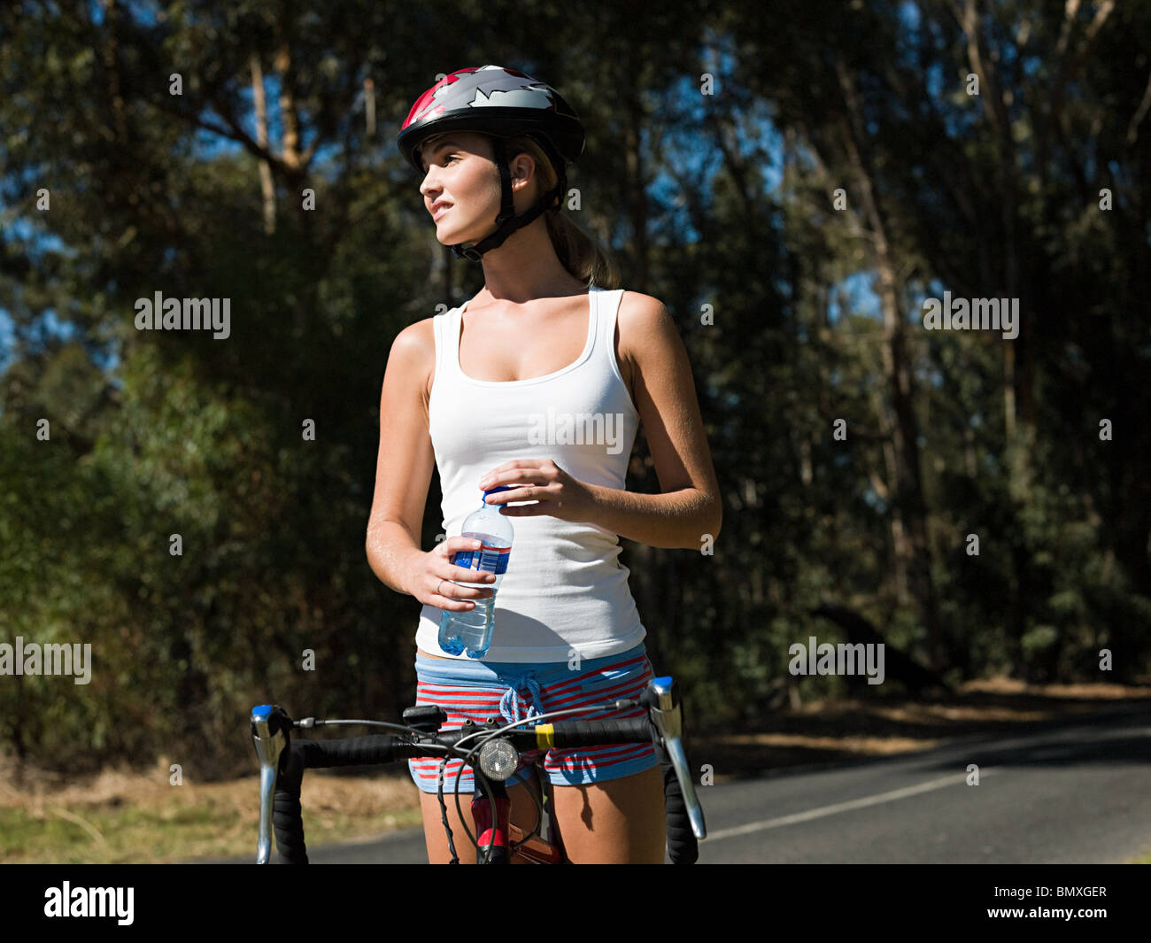Woman alone on road hi-res stock photography and images - Alamy