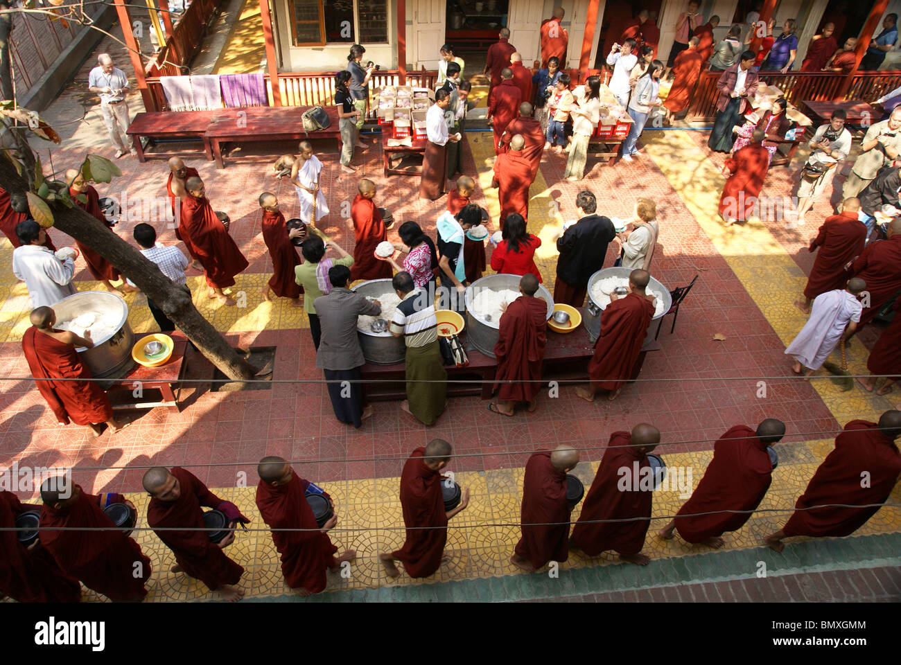 Myanmar, Amarapura, Mahagandayon Monastery, Buddhist Monks with bowls ...