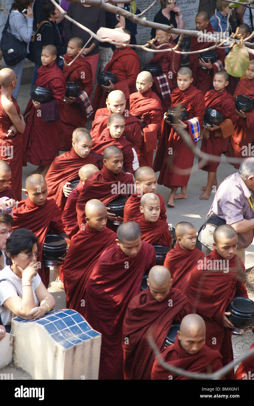 Myanmar, Amarapura, Mahagandayon Monastery, Buddhist Monks with bowls ...