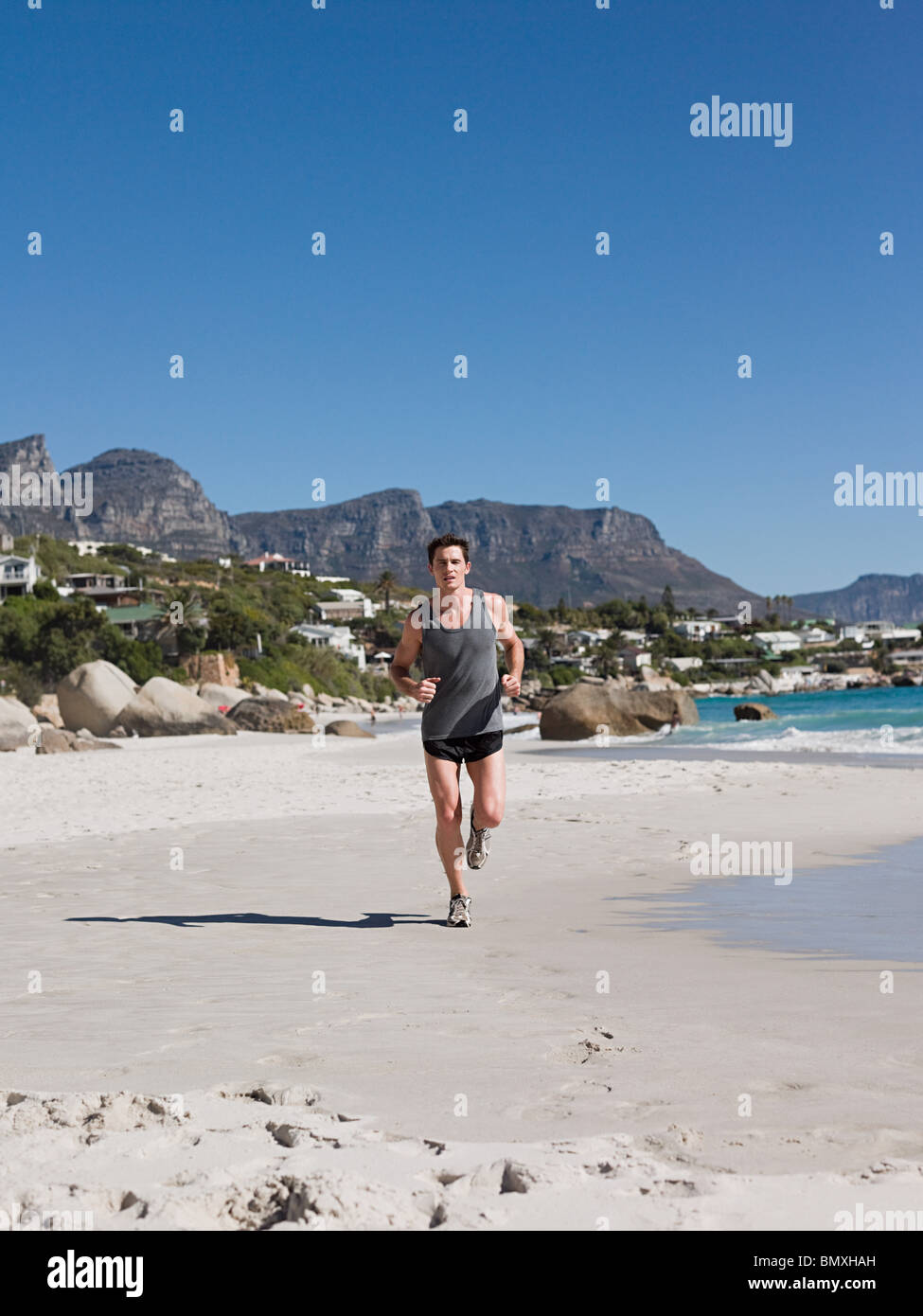 Beach man jogging hi-res stock photography and images - Alamy